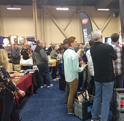 Trade show crowd at booth | Ads Up Promotions, LLC